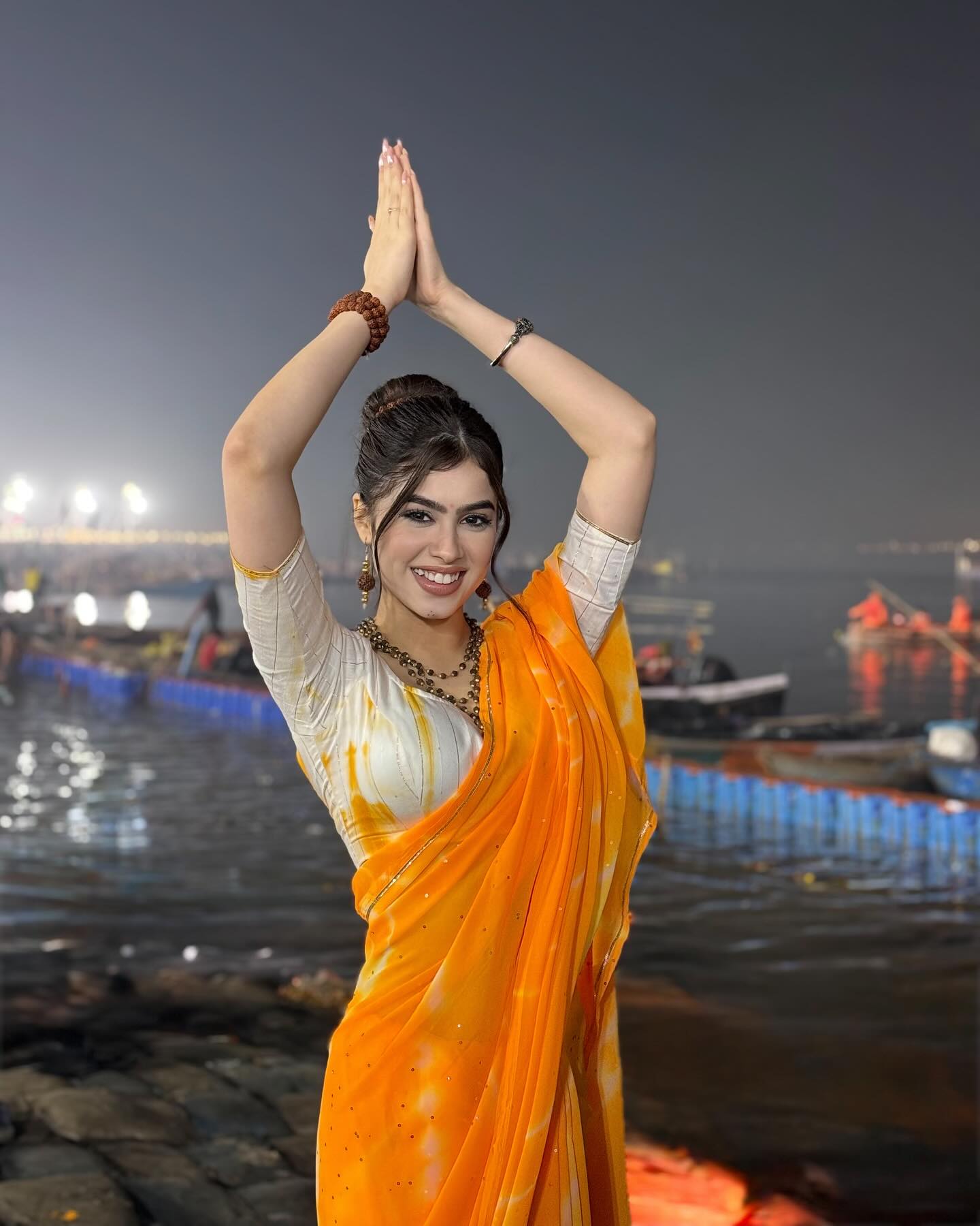 Riva Arora Stuns at Maha Kumbh 2025 in Saffron Saree and Rudraksha Garland